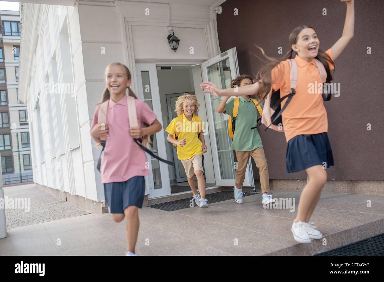 Kids running out of school hi-res stock photography and images - Alamy