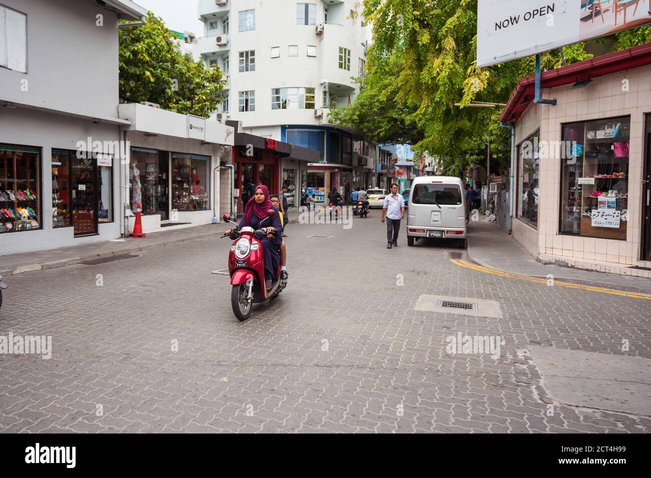 Male / Maldives - August 10, 2019: muslim woman with hijab riding ...