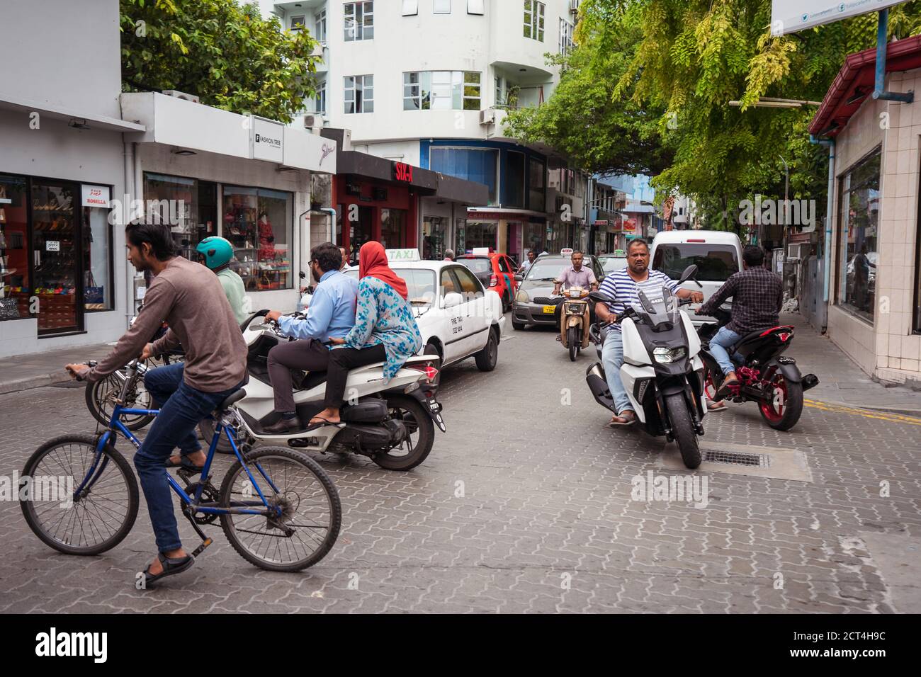 Male / Maldives - August 10, 2019: Muslim people riding motorcycles ...