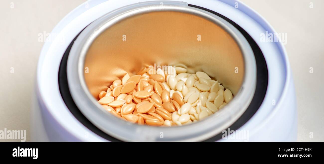 Electric wax warmer or wax heater with wax drops inside while heating ...
