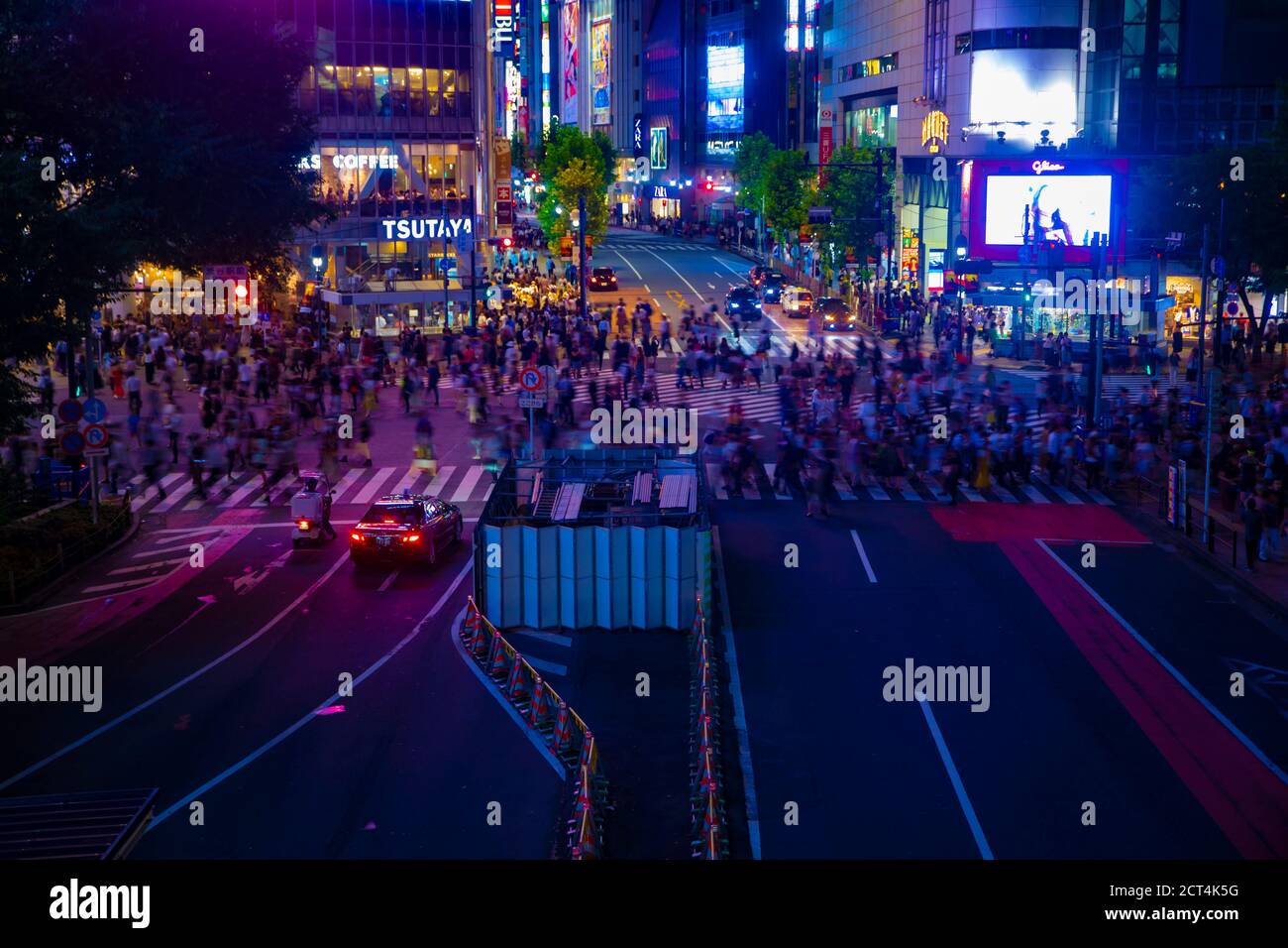 A scramble crossing at the neon town in Shibuya Tokyo wide shot Stock ...