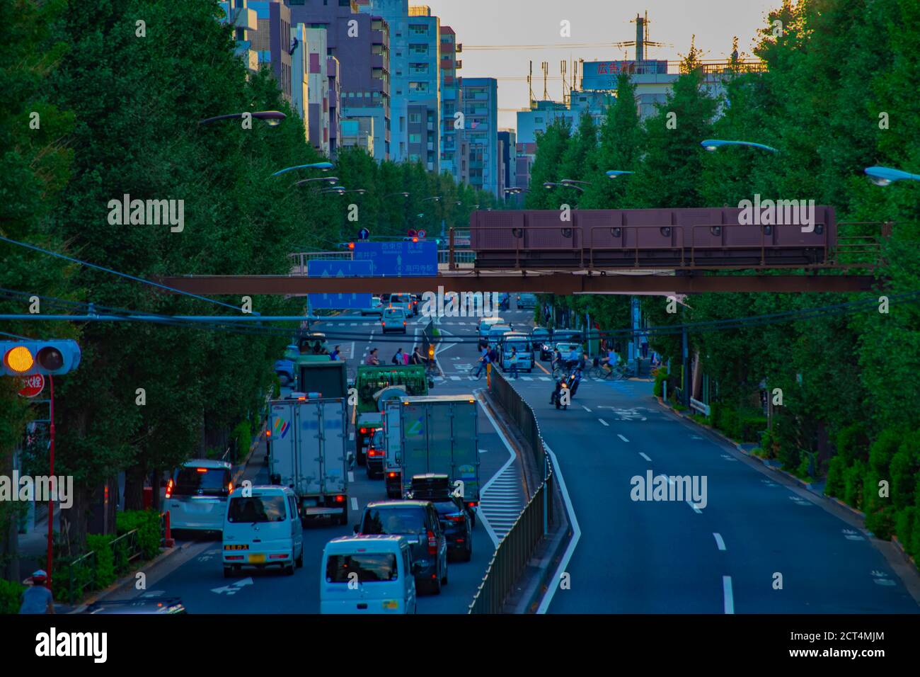 A city street at Oume avenue in Tokyo daytime long shot Stock Photo - Alamy