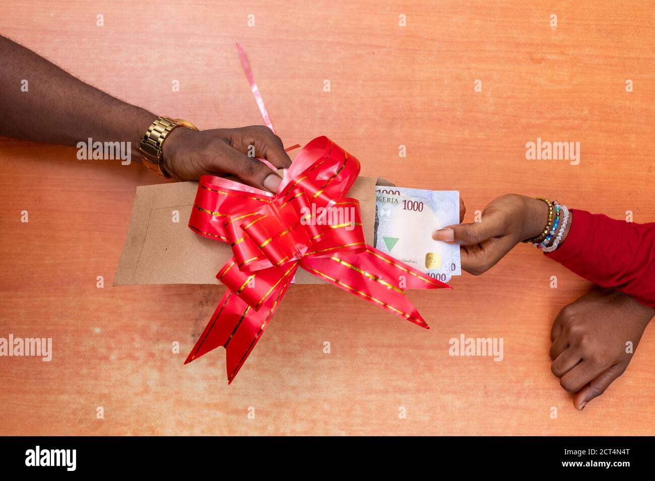 Woman giving money to a friend hi-res stock photography and images - Alamy