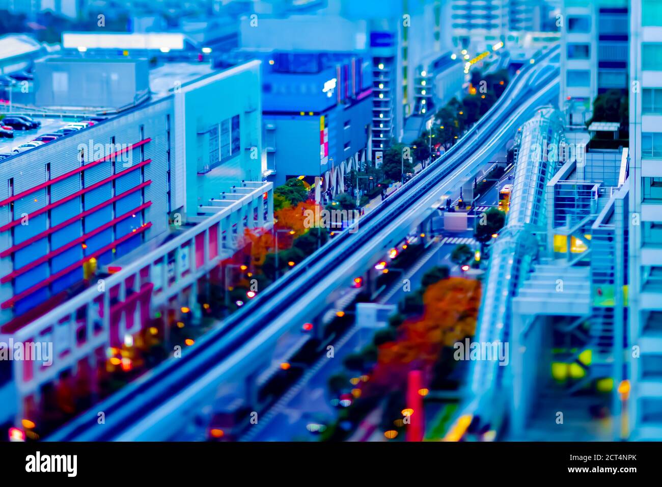 A dusk of the train on the city railway in Tokyo high angle tiltshift ...