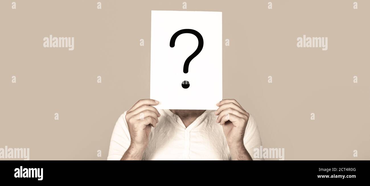 Man a question. Doubtful man holding Question Mark. Question mark ...
