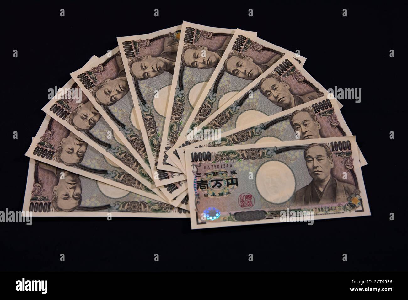 Japanese currency 100,000 yen on the black background closeup Stock ...