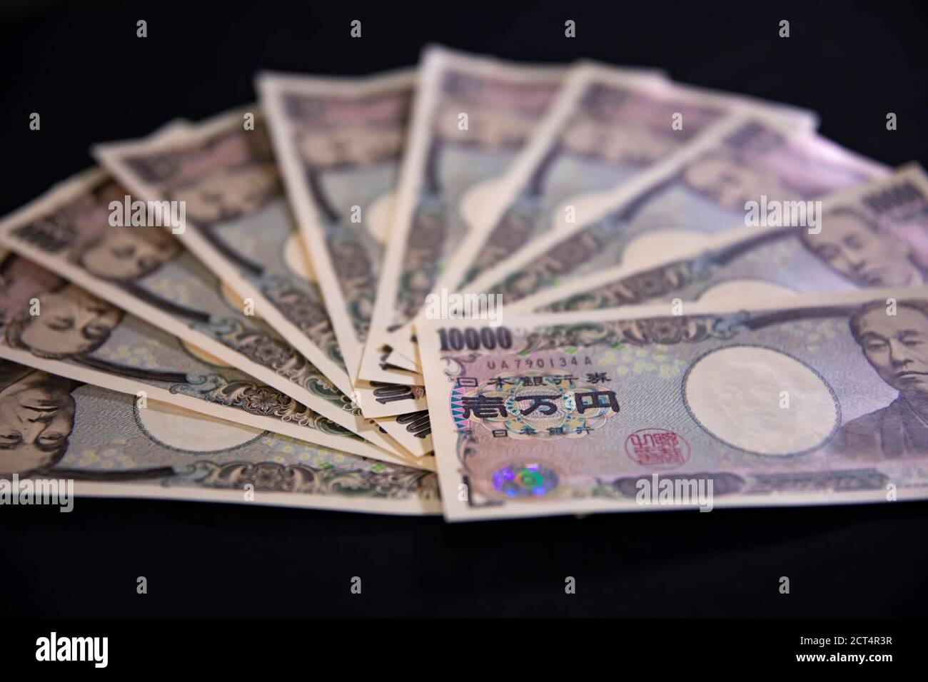 Japanese currency 100,000 yen on the black background closeup Stock ...
