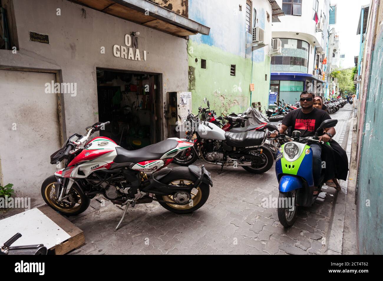 Male / Maldives - August 10, 2019: Muslim people riding motorcycles ...