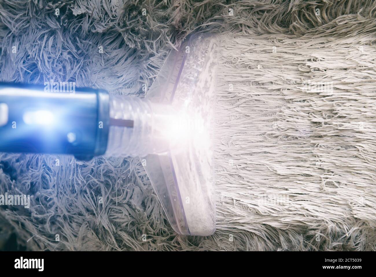 Cleaning dirt with machine extractor vacuum cleaner Stock Photo - Alamy