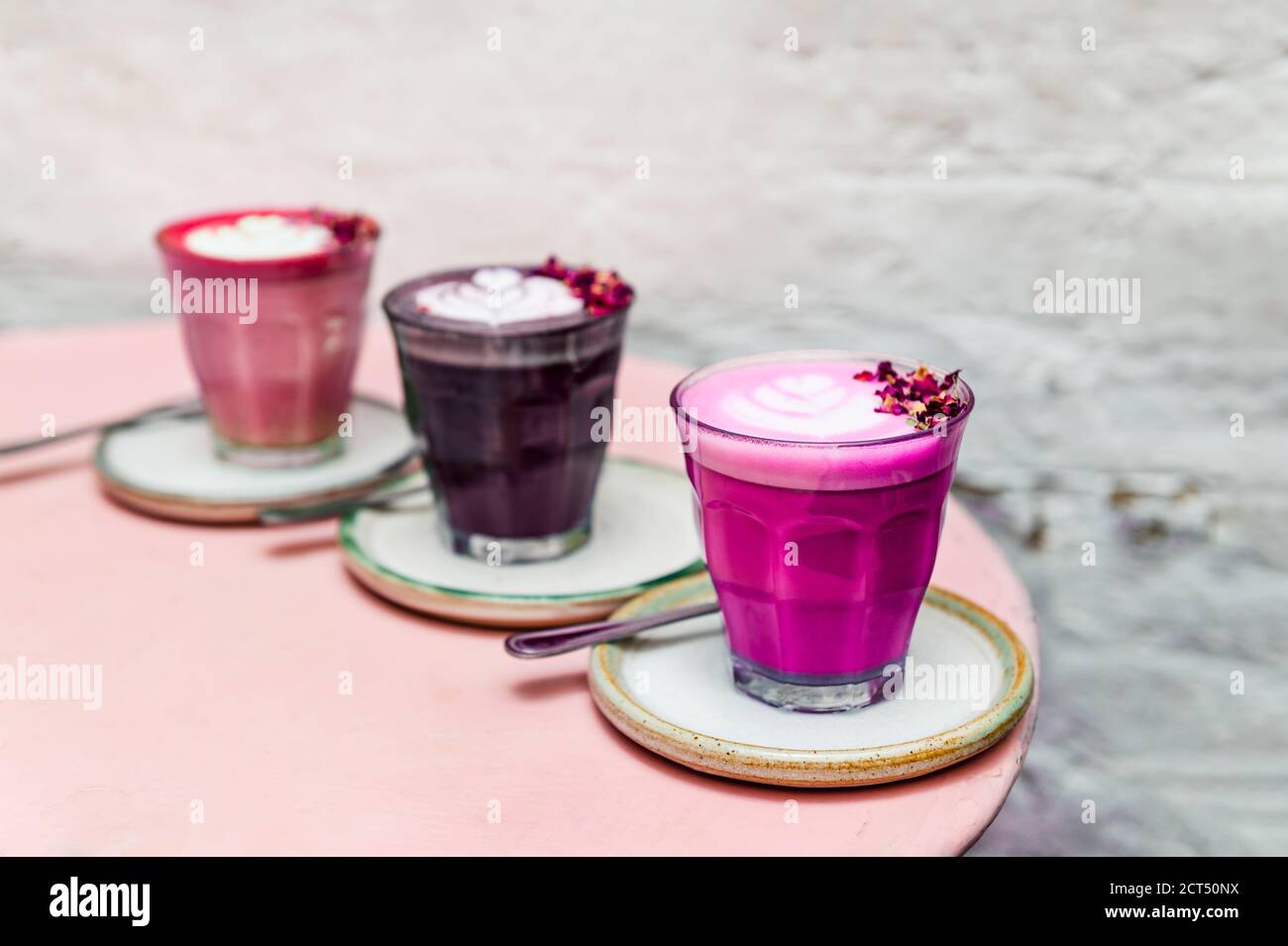 Different Healthy Super Lattes in cafe Stock Photo - Alamy