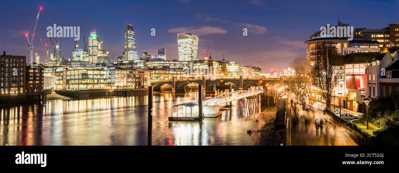 Bankside Pier and the Thames, with 'The City' behind at night, London ...