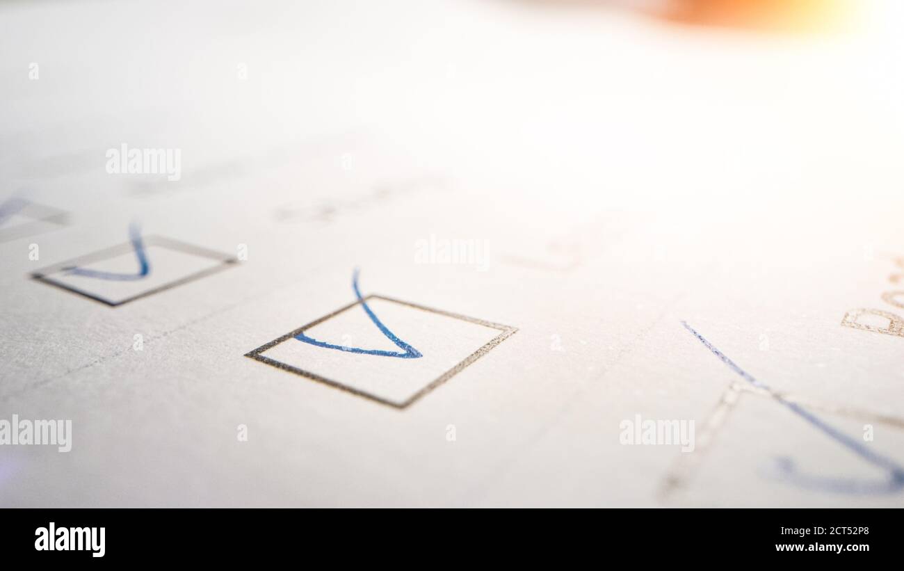 Person Ticks Checkbox Marks with a Pen, filling up To Do List. Checking ...