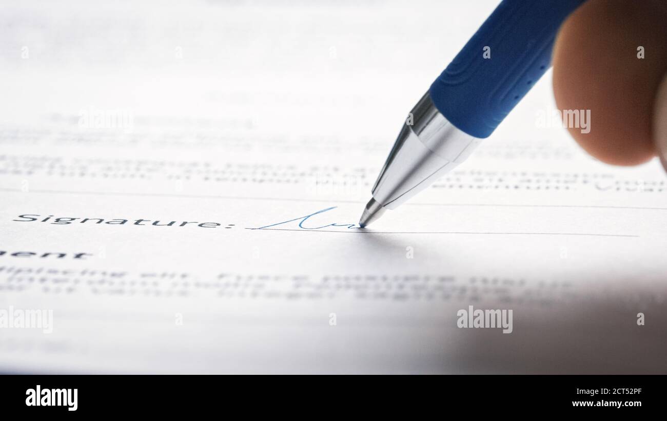 Businesswoman signs important legal document hi-res stock photography ...