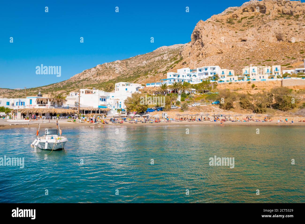 Small sandy beach of Finiki village with taverns in the background ...