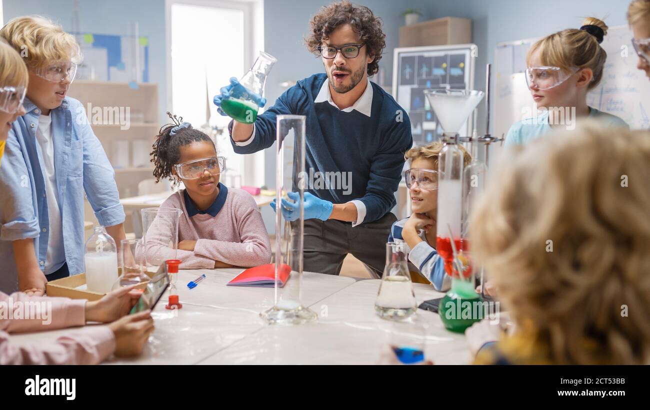 Elementary School Science Chemistry Classroom: Teacher Shows Chemical ...