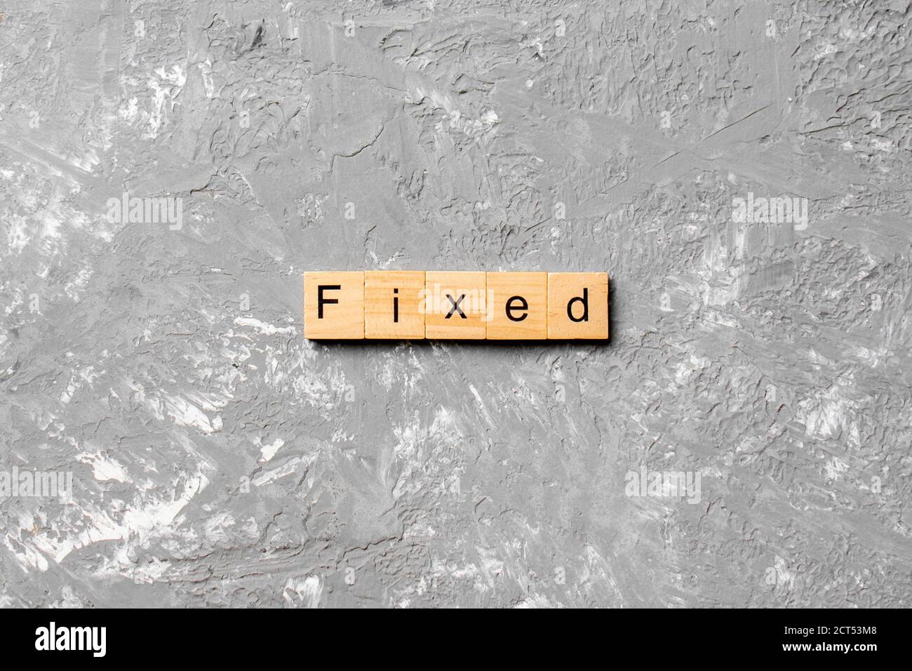 fixed word written on wood block. fixed text on table, concept Stock ...