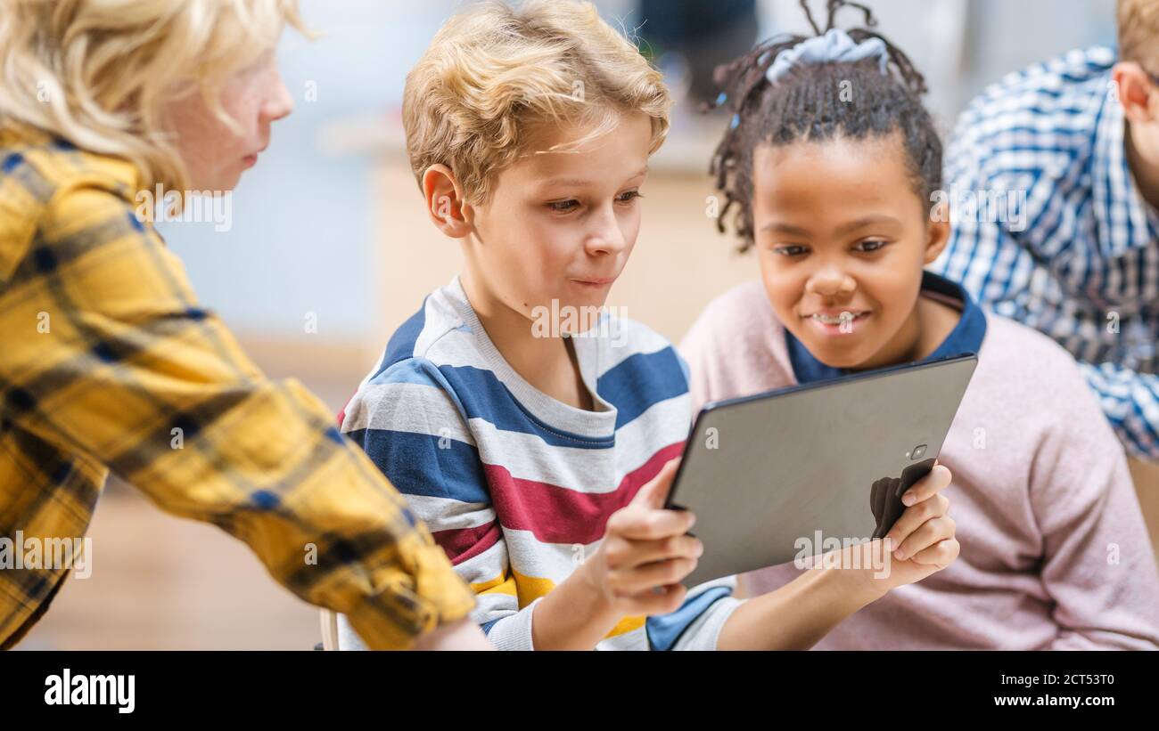 Elementary School Computer Science Class: Children Use Digital Tablet ...