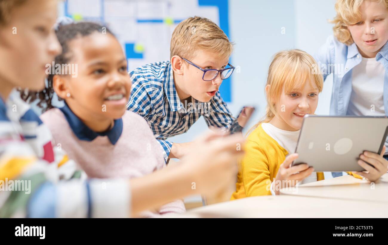 Elementary School Computer Science Class: Children Use Digital Tablet ...