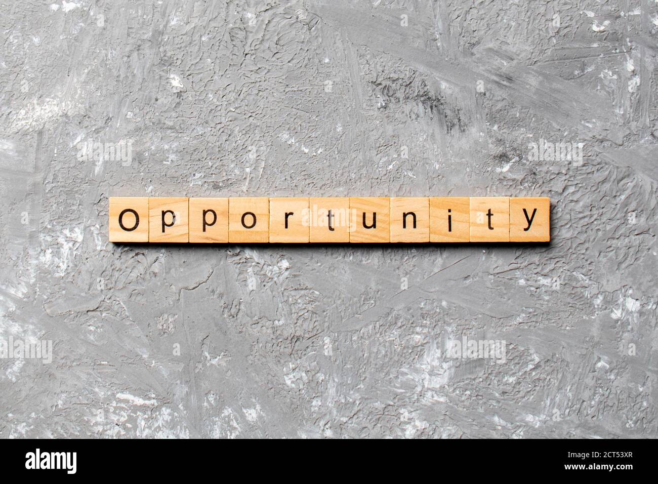 Opportunity word written on wood block. Opportunity text on table ...