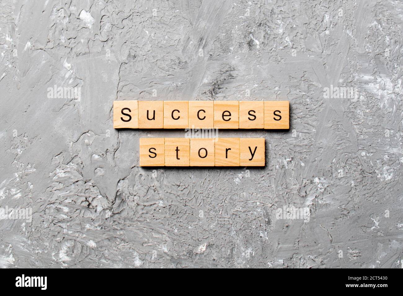Success story word written on wood block. Success story text on table ...