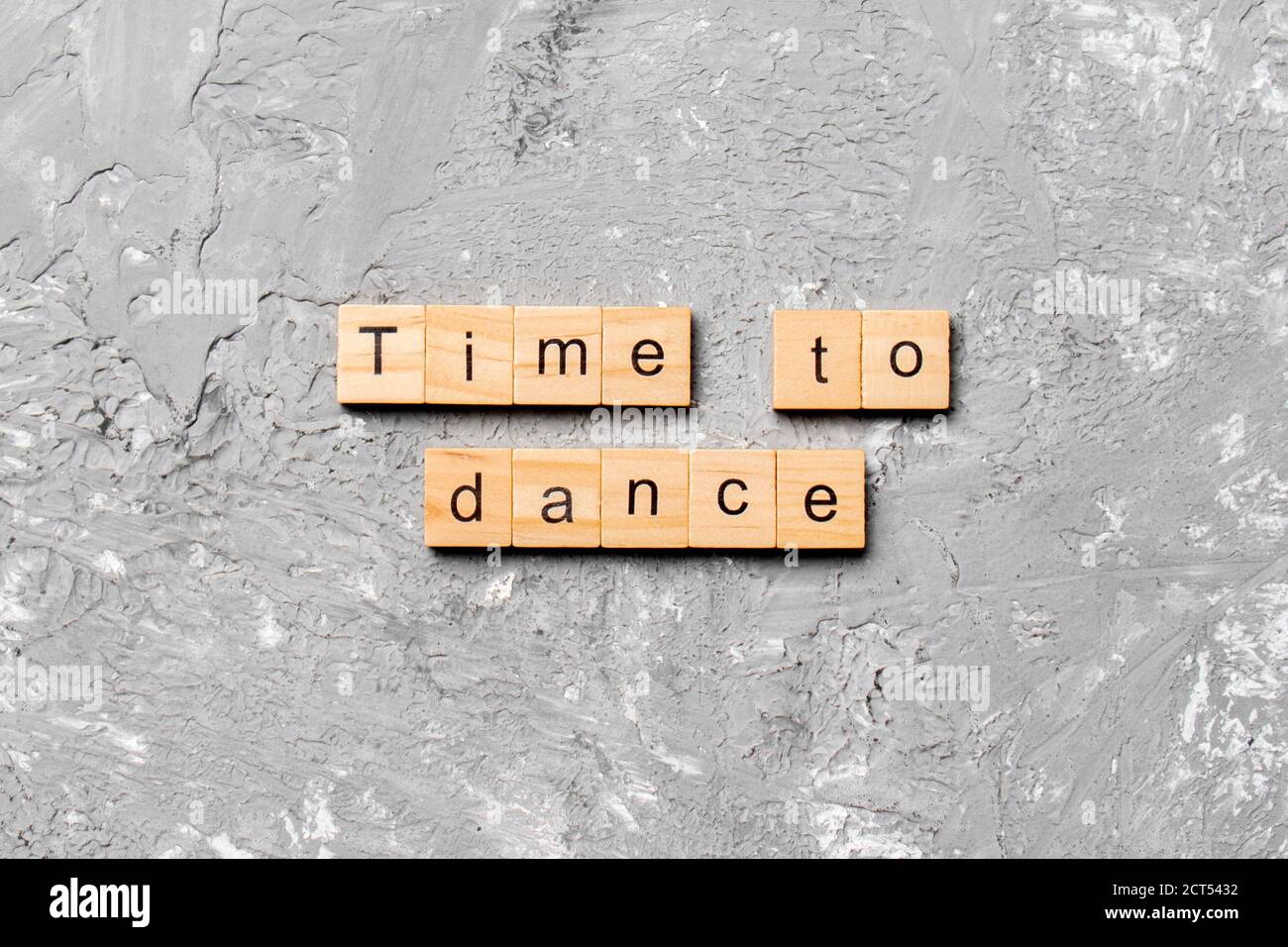 time to dance word written on wood block. time to dance text on cement ...