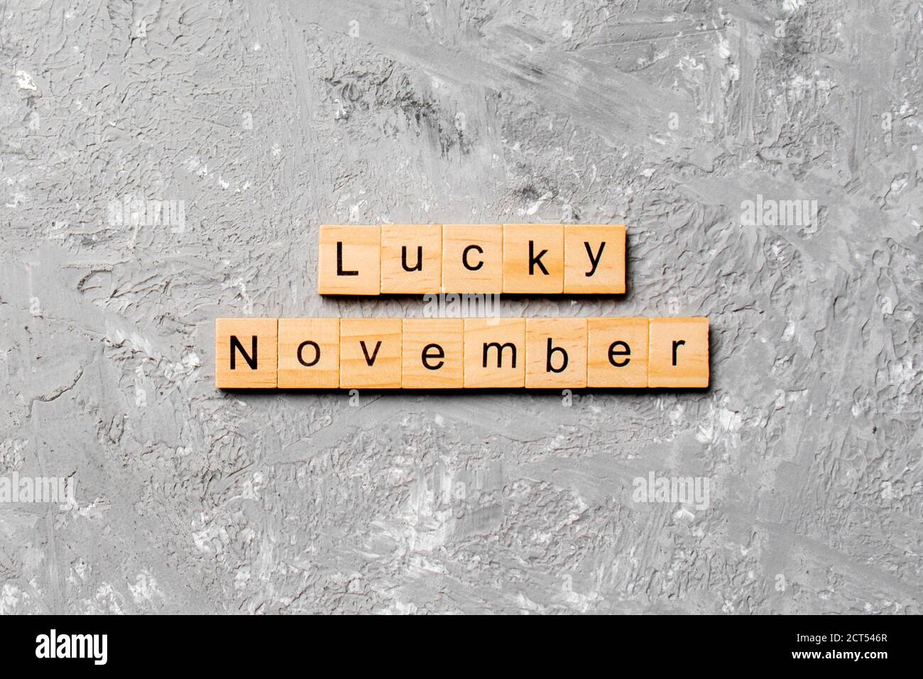 lucky november word written on wood block. lucky november text on table ...
