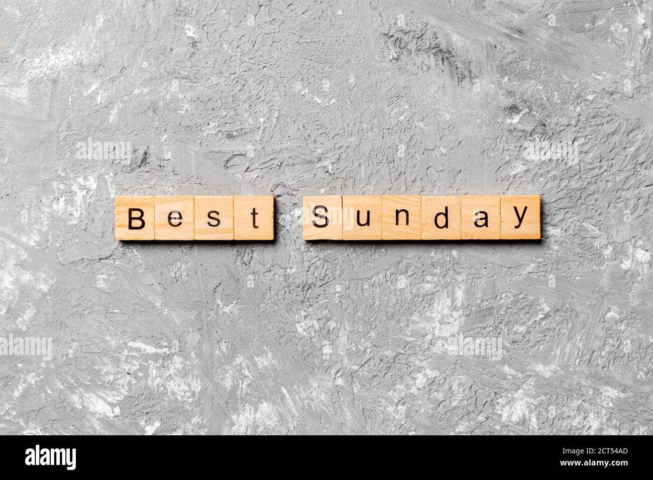 best sunday word written on wood block. best sunday text on cement ...