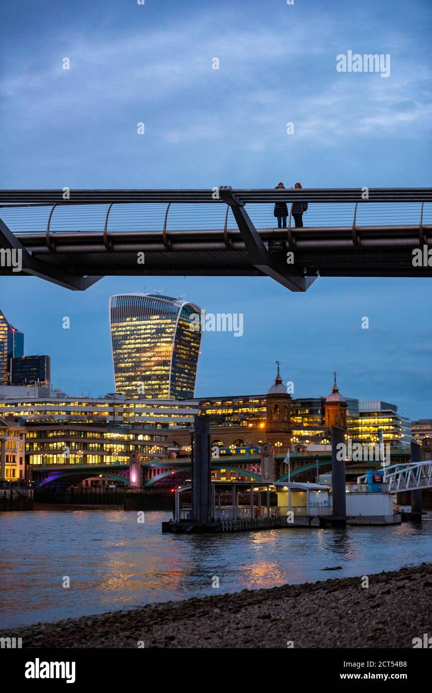 Millennium Bridge and the Walkie Talkie building at night, City of ...