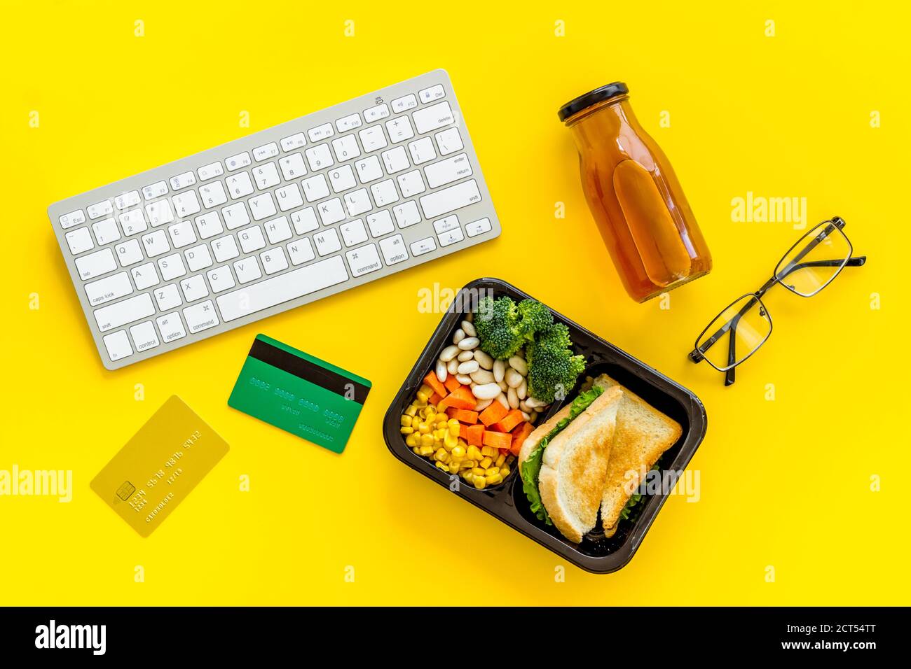 Lunch at workplace. Delivery boxes with meal, top view Stock Photo - Alamy