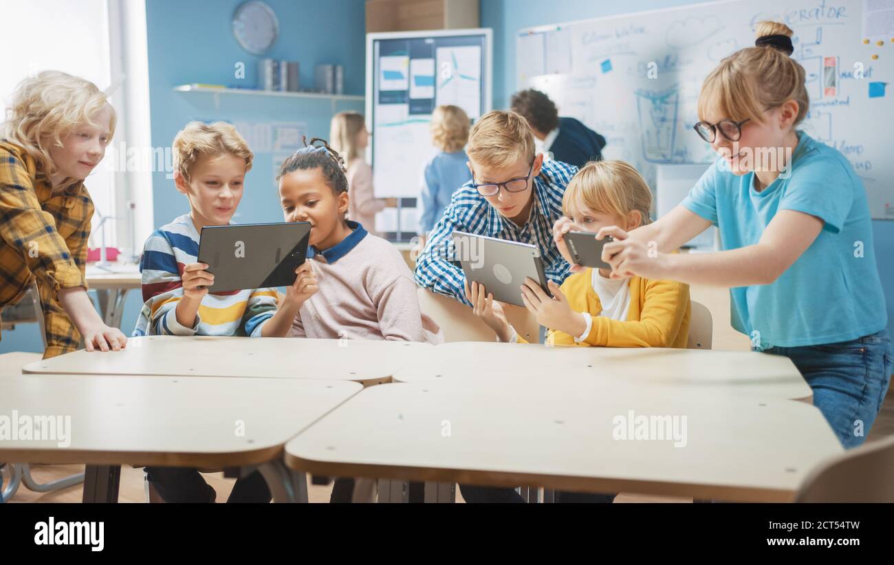 Elementary School Computer Science Class: Children Use Digital Tablet ...