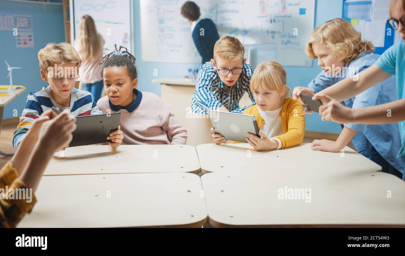 Elementary School Computer Science Class: Children Use Digital Tablet ...