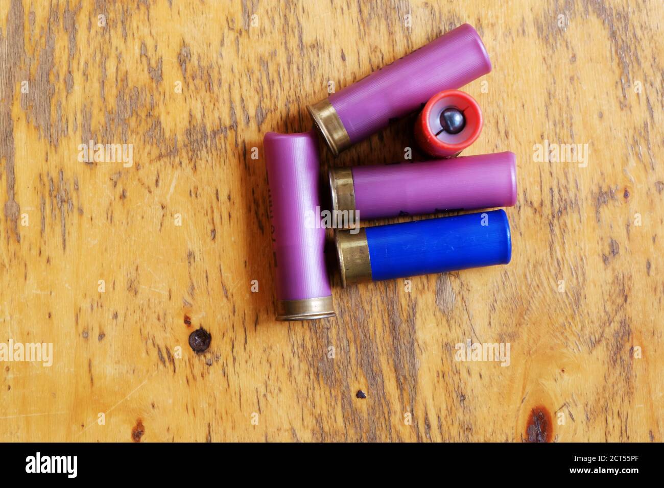 Hunting cartridges for a smoothbore rifle on an old wooden lacquered ...