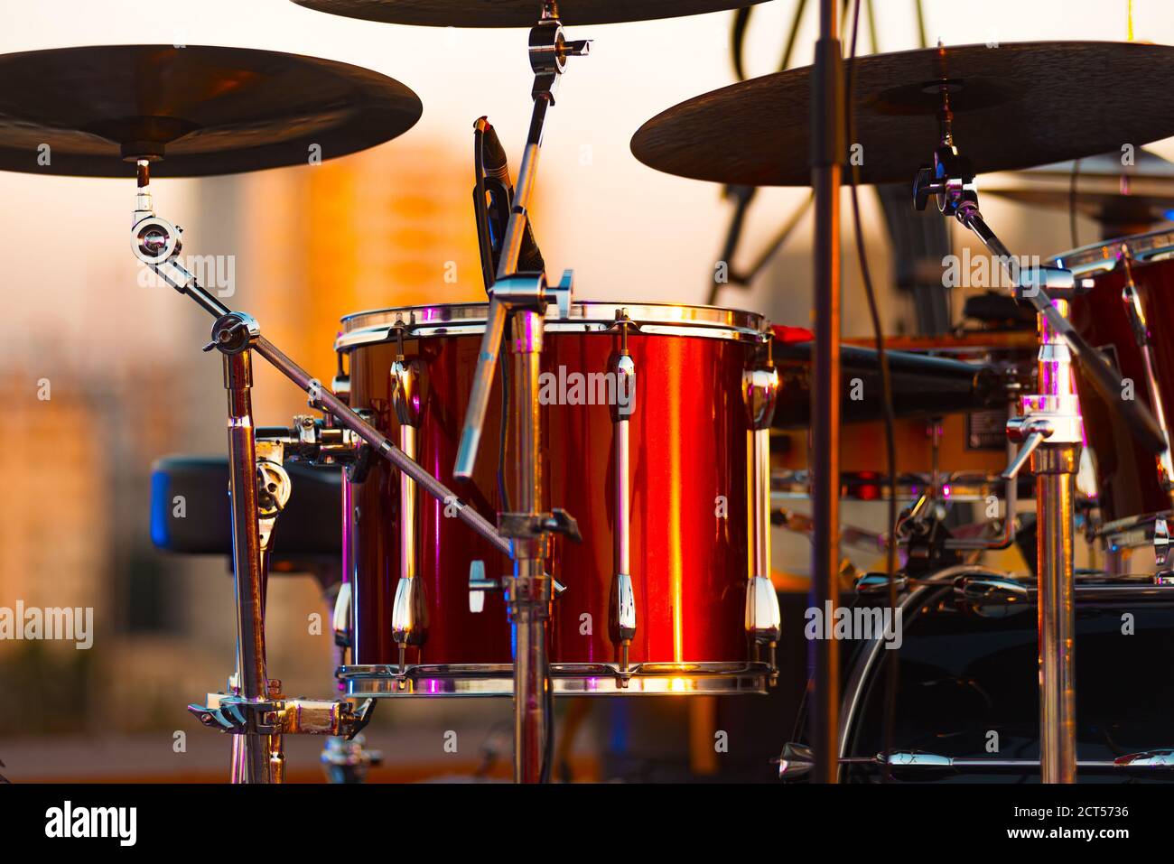 A close up photo of red drums on the stage Stock Photo - Alamy