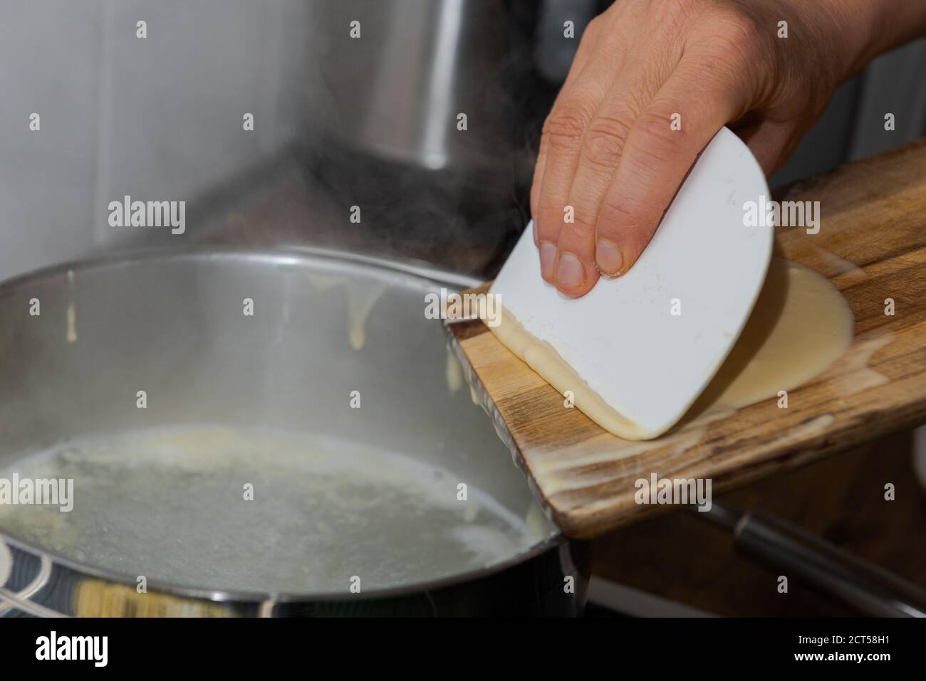 Making Spaetzle, a traditional south german specialty food made of ...