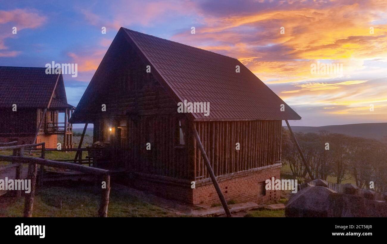 Wooden cabin with a beautiful view of the sunset Stock Photo - Alamy