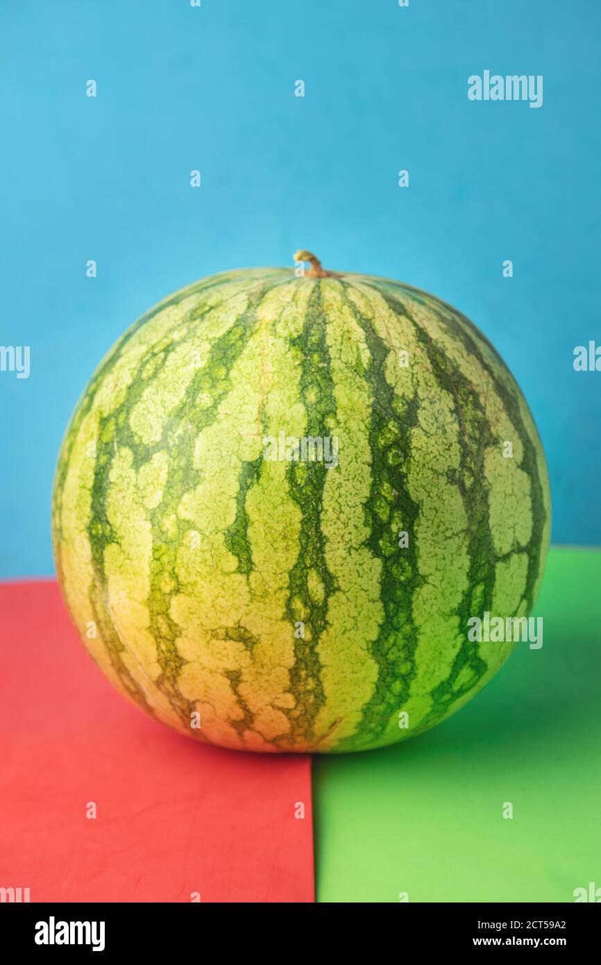 Vertical shot of fresh watermelon on a colorful background Stock Photo ...