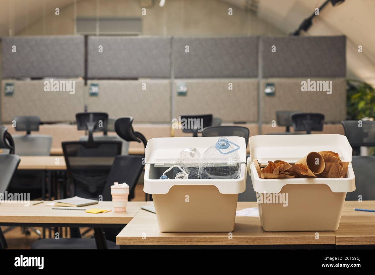 Background image of two waste sorting containers on desk in office ...