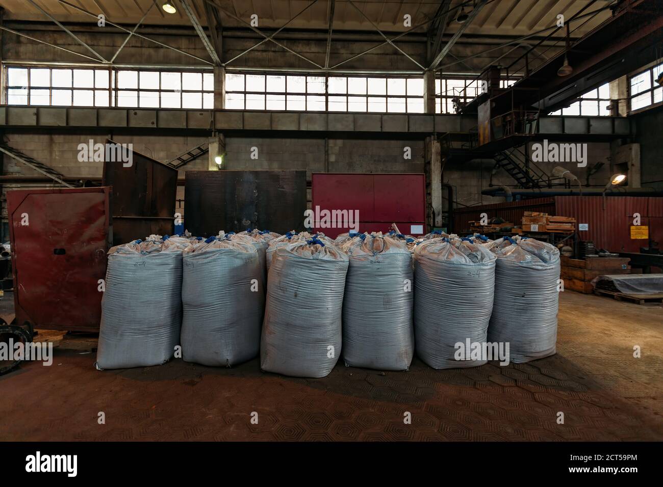 White polyethylene bags with factory products in warehouse Stock Photo ...