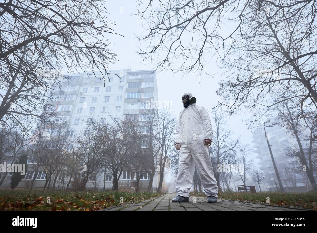Full length of male environmentalist in radiating suit standing on ...
