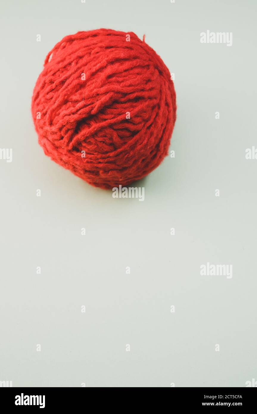 Vertical high angle shot of a ball of red yarn Stock Photo - Alamy
