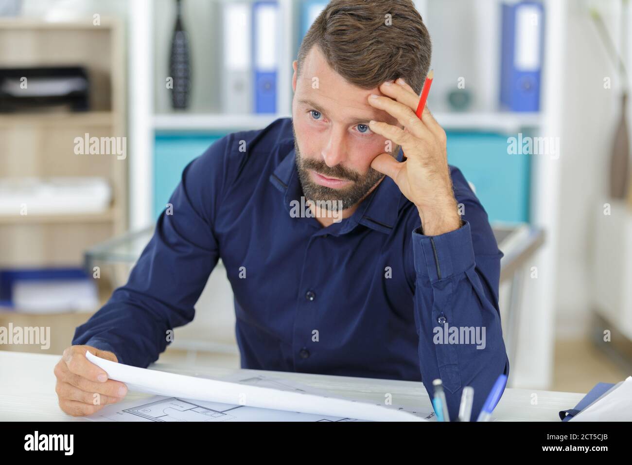 architect thinking about house construction Stock Photo - Alamy