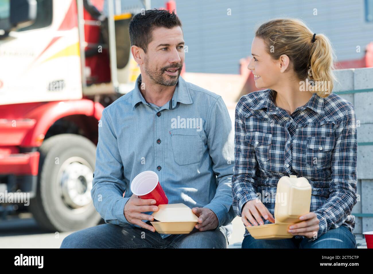 work colleagues eating a takeaway outdoors Stock Photo - Alamy