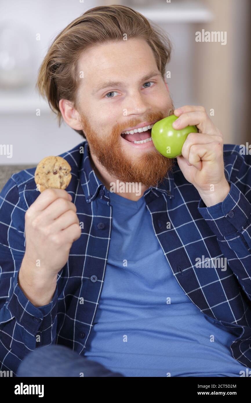Man biting cookie hi-res stock photography and images - Alamy