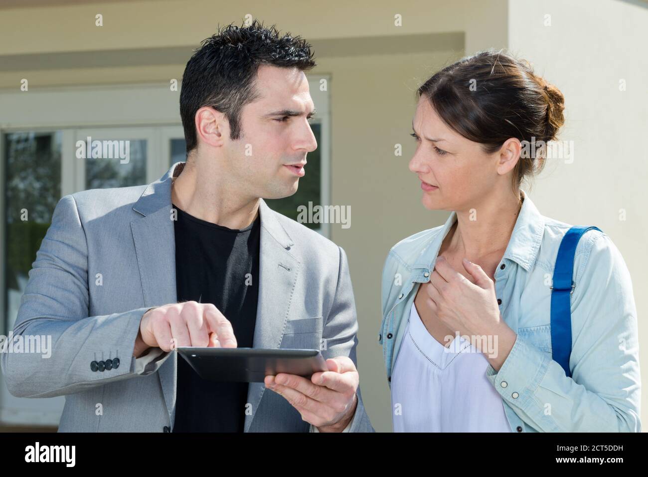 portrait of people talking outside office building Stock Photo - Alamy