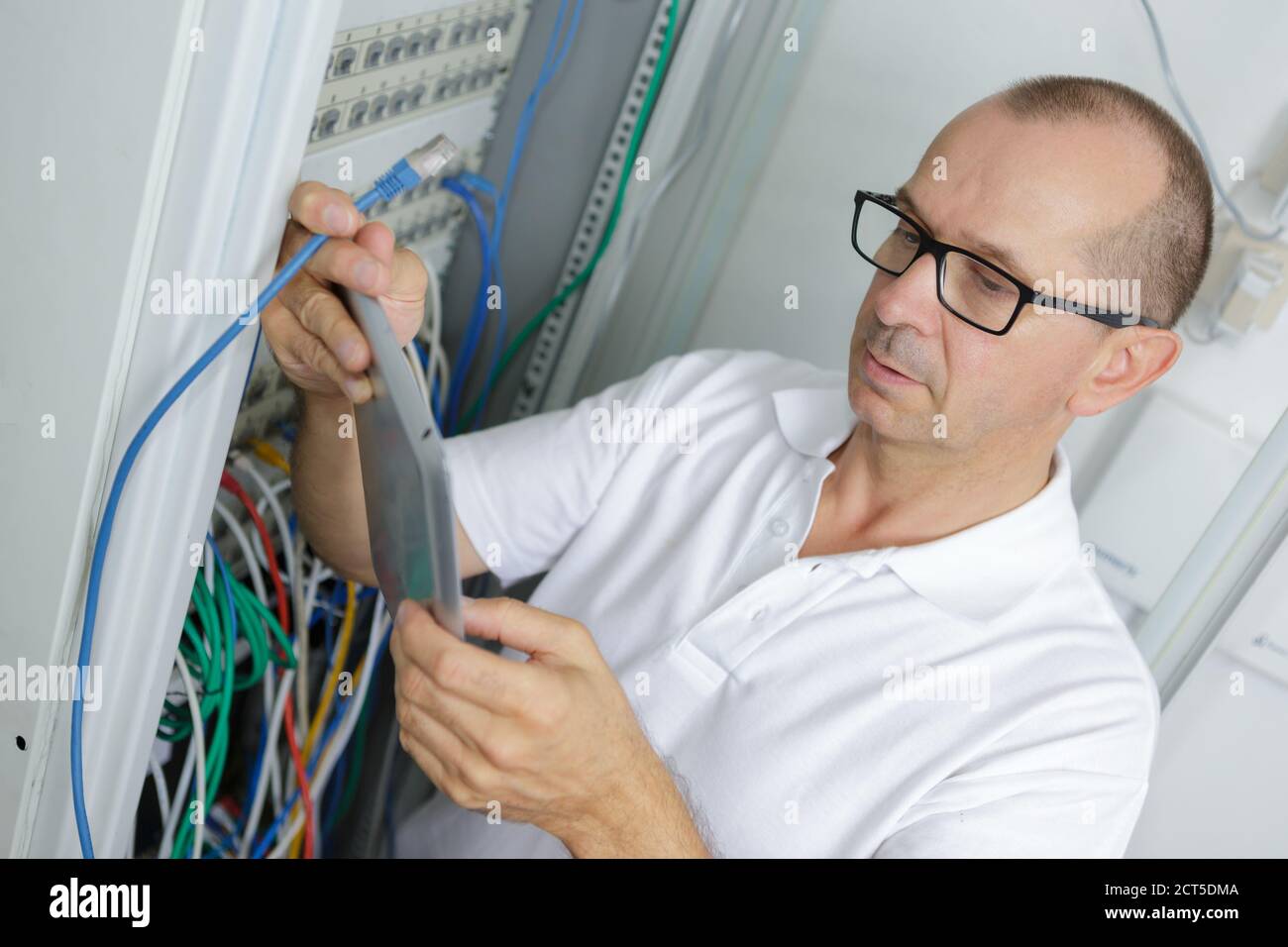 man in network server room Stock Photo - Alamy