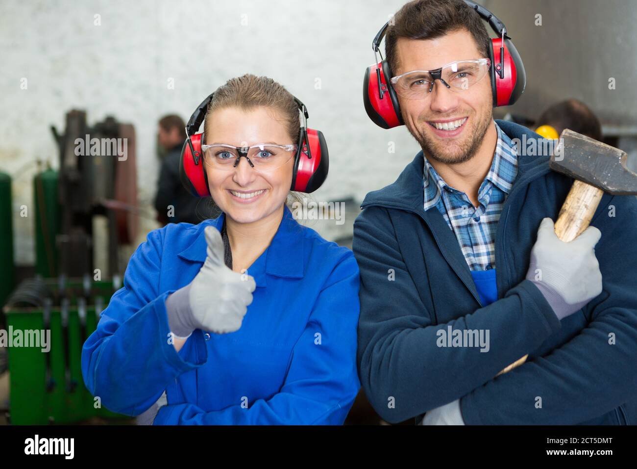 professional female and male looking at camera Stock Photo - Alamy
