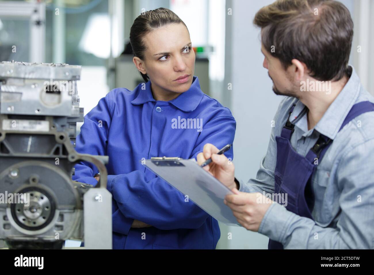 two maintenance engineers going through a checklist Stock Photo - Alamy