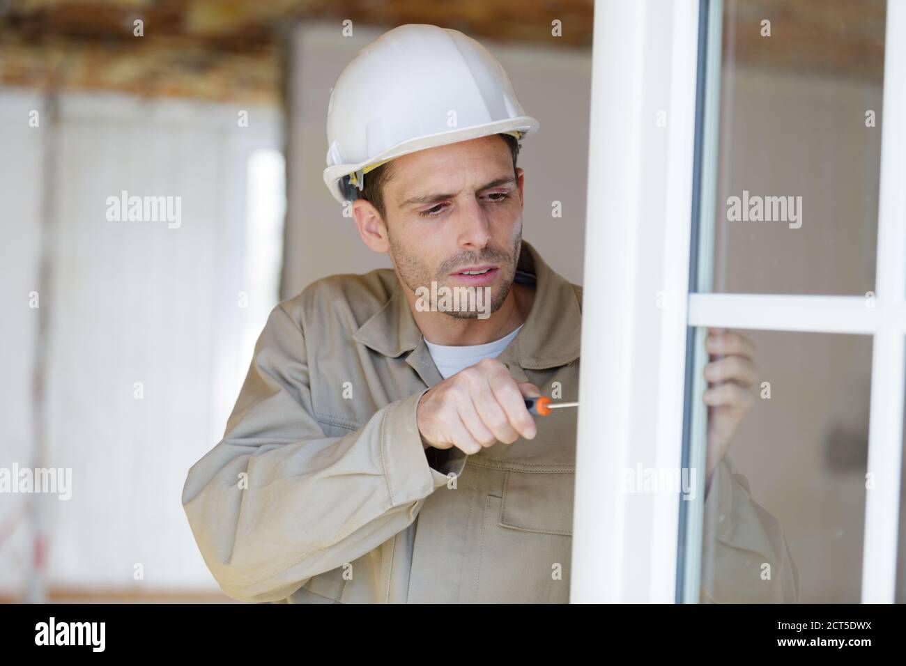 Construction worker fixing cabling on hi-res stock photography and ...