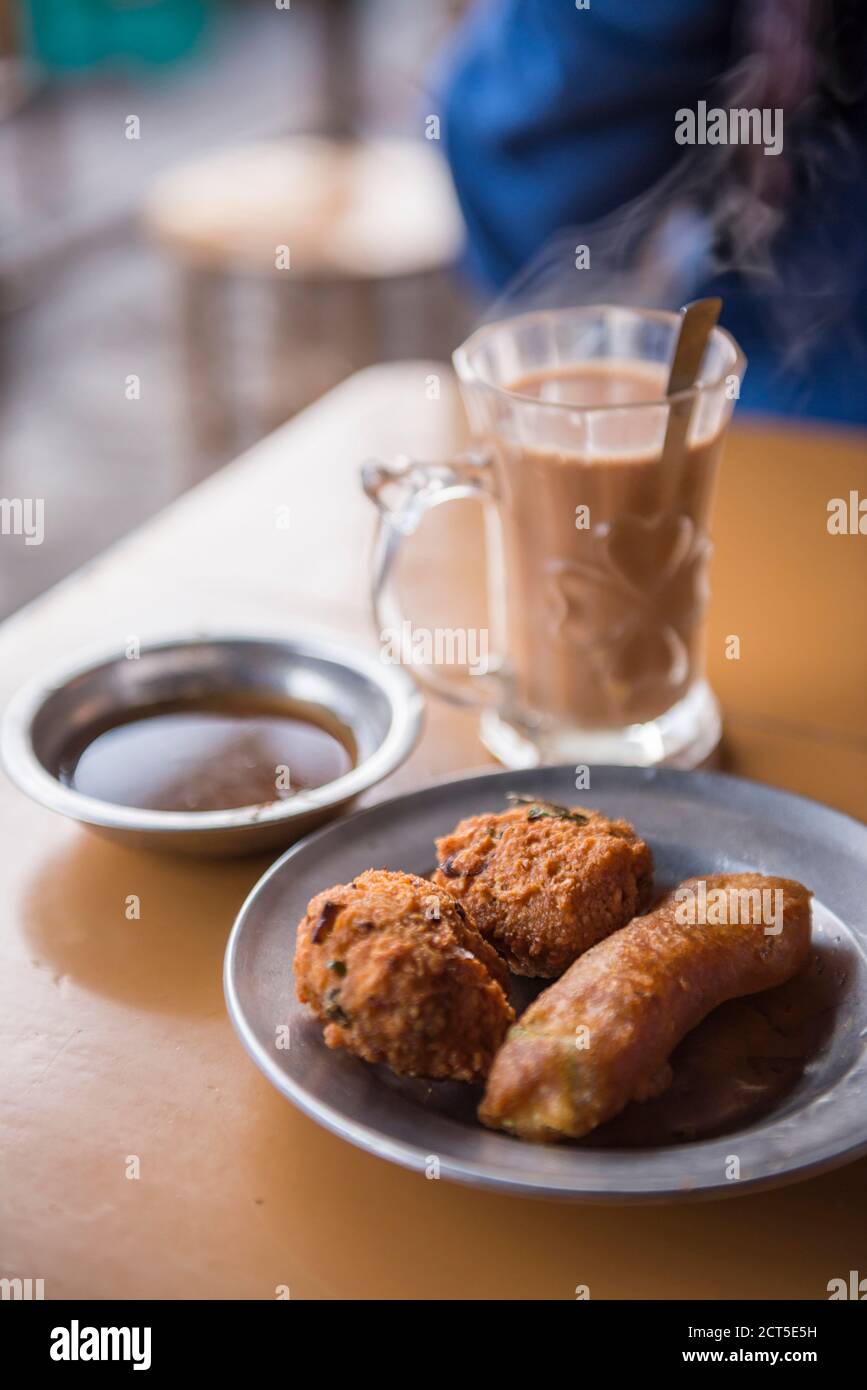 Deep fried aubergine and Burmese Sweet Tea, a typical Burmese breakfast ...