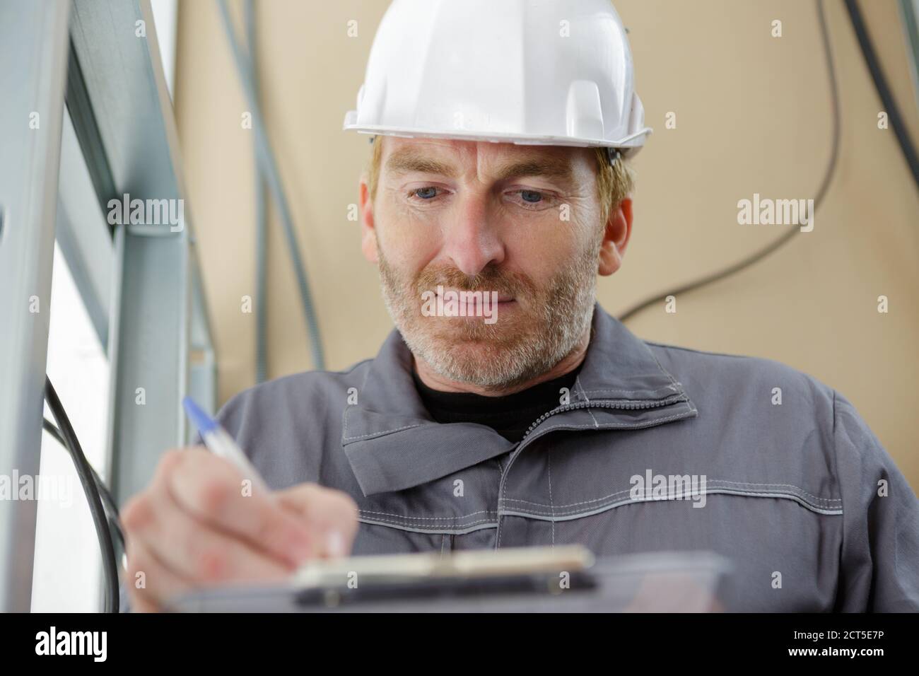Caucasian worker in overall helmet hi-res stock photography and images ...